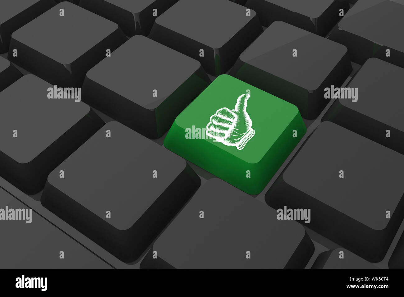 Thumbs up against black keyboard with green key Stock Photo - Alamy