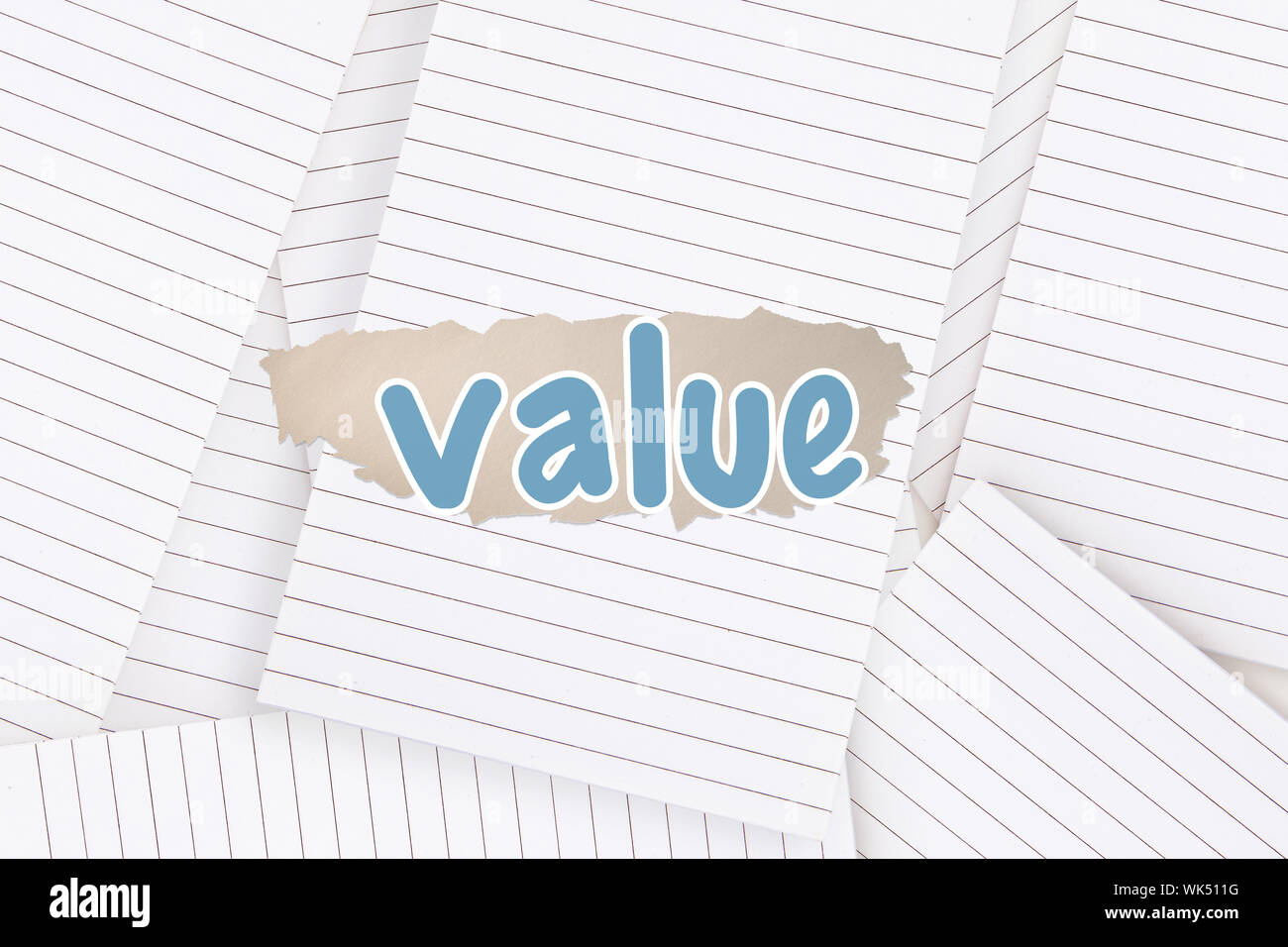 The word value against lined paper strewn over surface Stock Photo - Alamy
