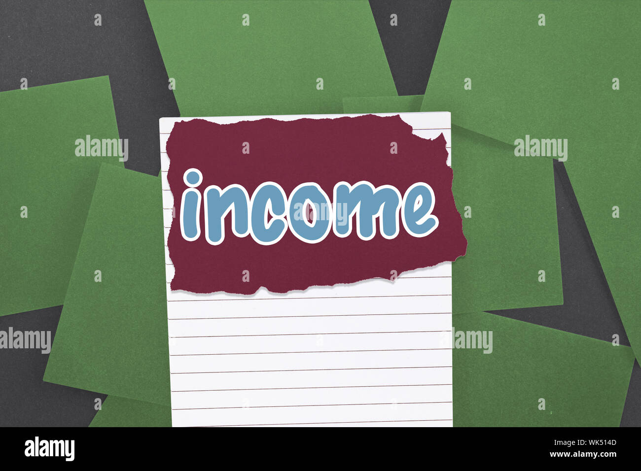 The word income against green paper strewn over black Stock Photo - Alamy