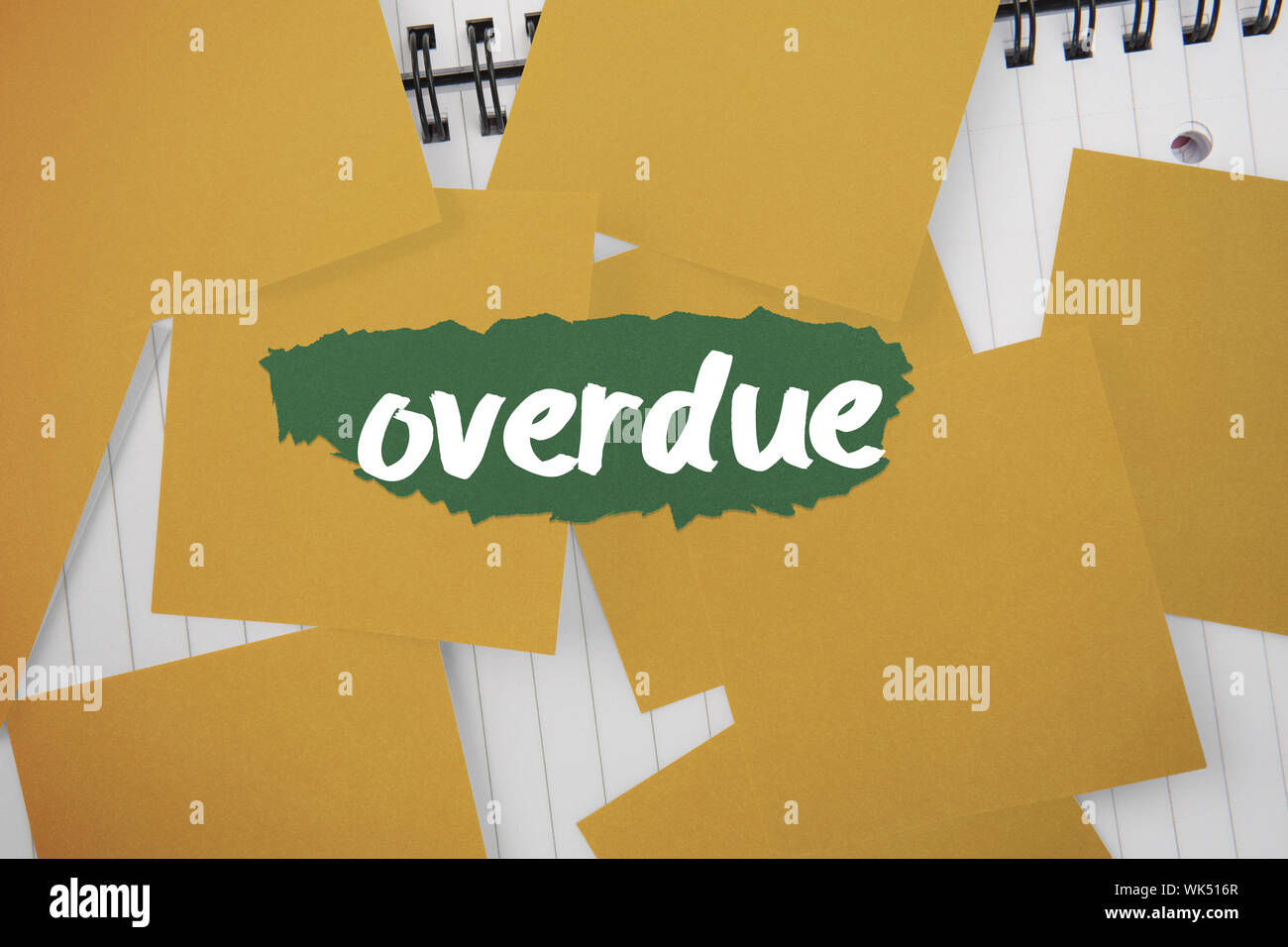 The word overdue against yellow paper strewn over notepad Stock Photo ...