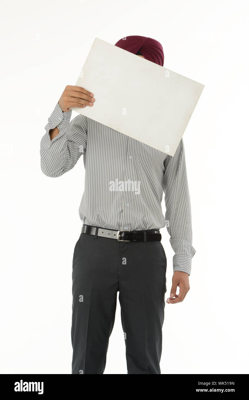 Indian young man showing a placard in front of his face Stock Photo - Alamy