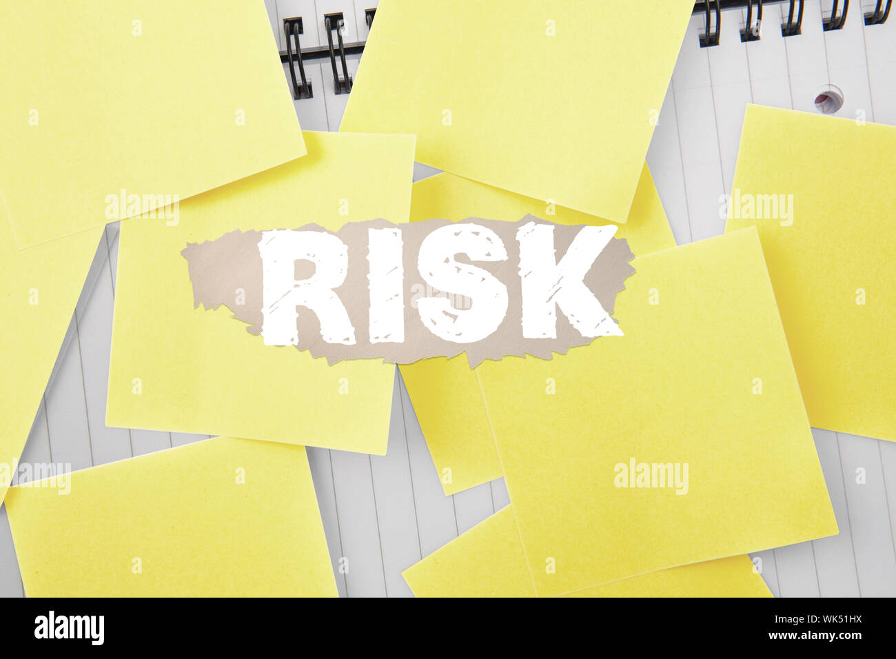 The word risk against sticky notes strewn over notepad Stock Photo - Alamy