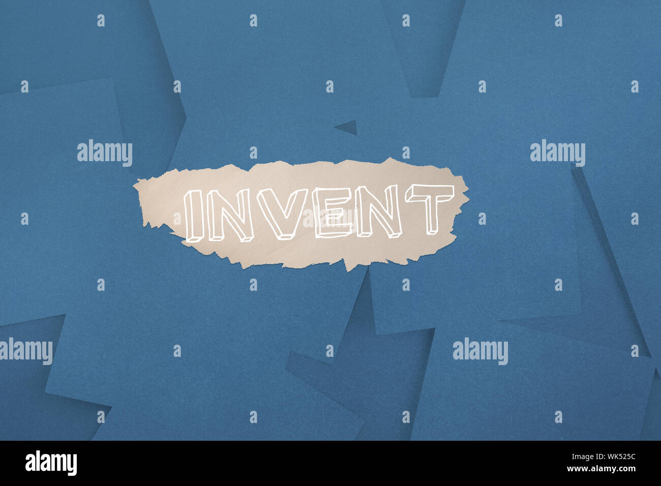The word invent against digitally generated blue paper strewn Stock ...