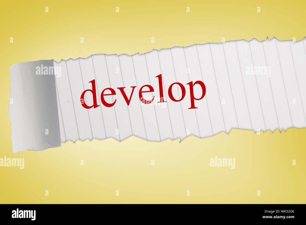 The word develop against yellow vignette Stock Photo - Alamy