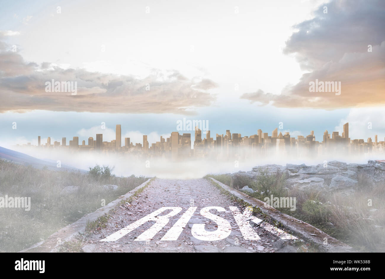 The word risk against rocky path leading to large urban sprawl Stock ...