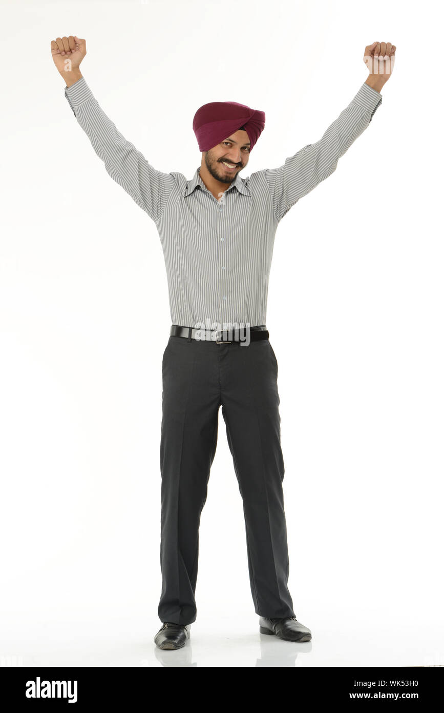 Young man celebrating his success and smiling Stock Photo - Alamy