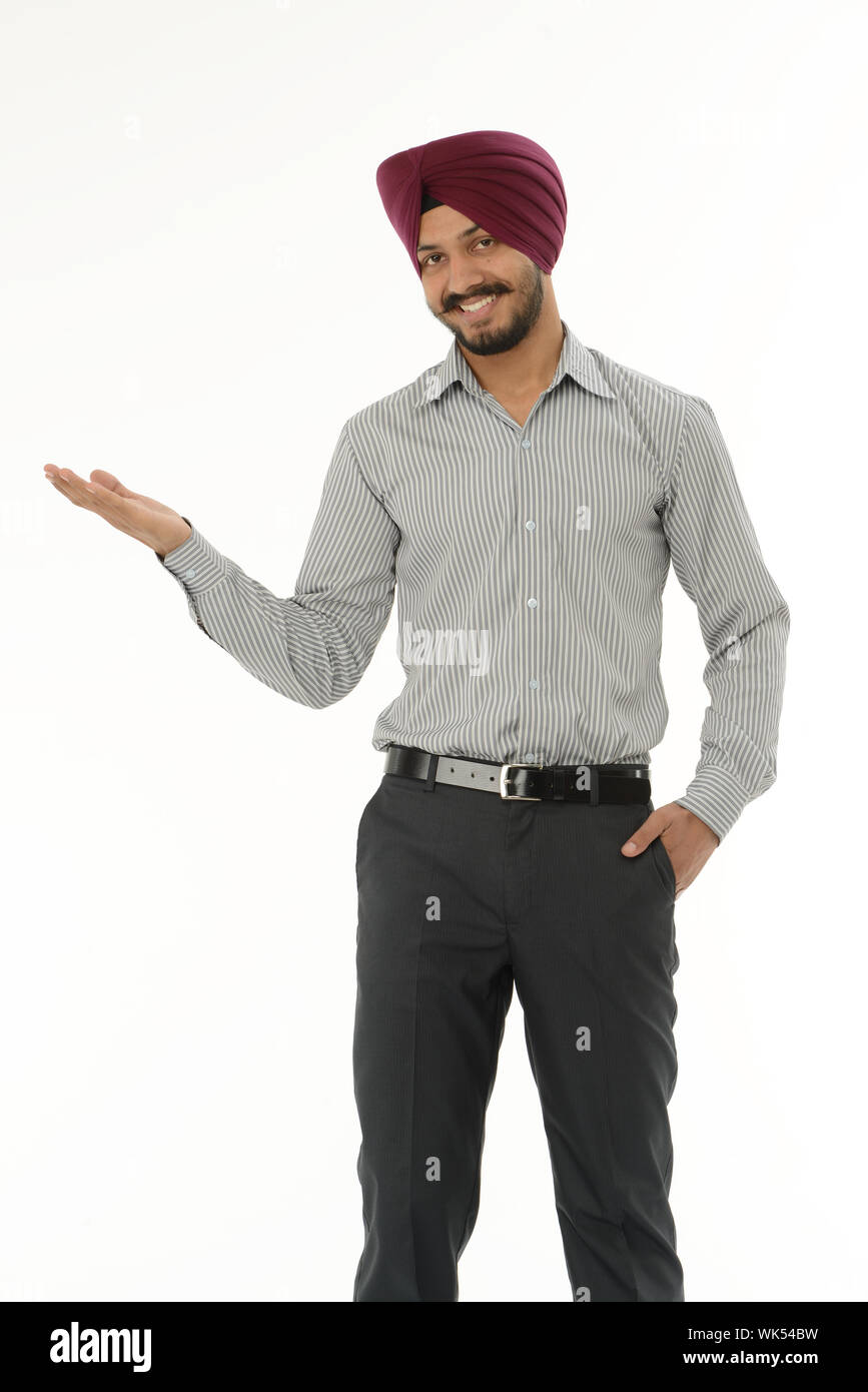 Young man standing with his arm outstretched Stock Photo - Alamy