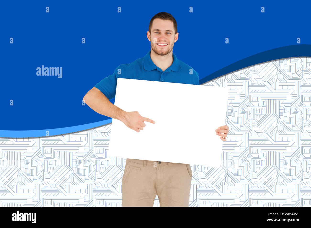 Handsome young man showing card against blue and white background Stock ...