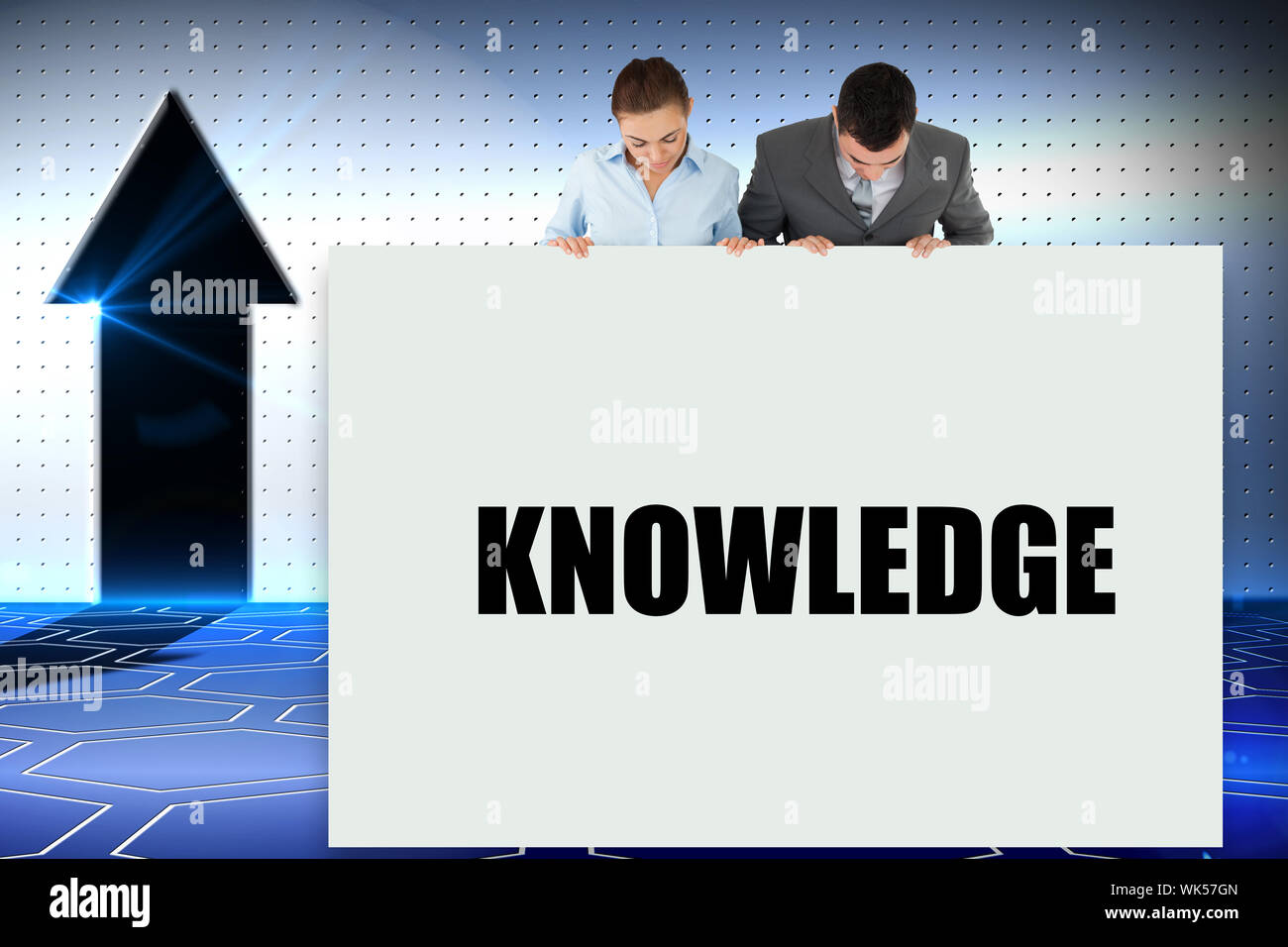 Business partners showing card saying knowledge against digital ...