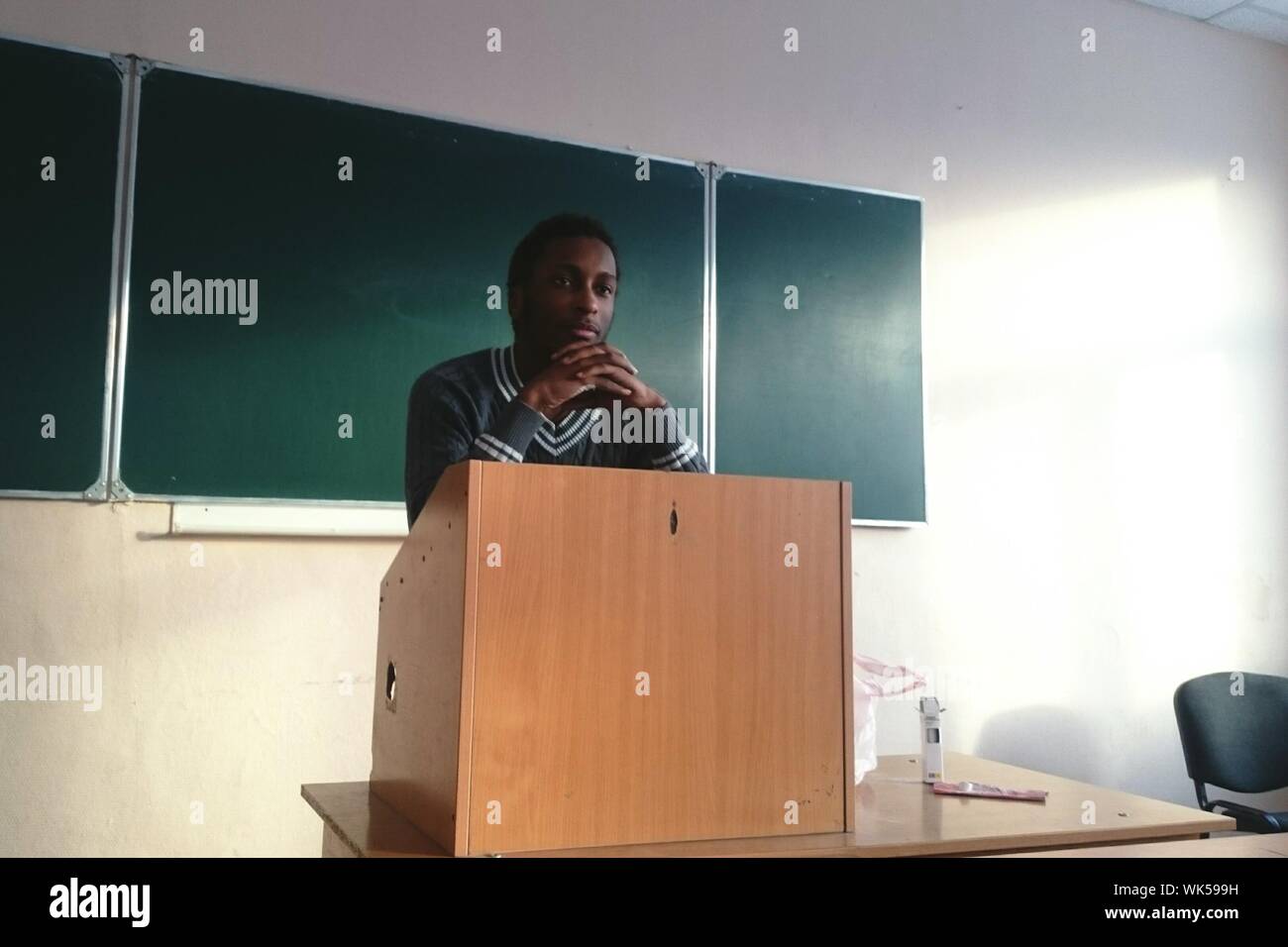 Student standing classroom hi-res stock photography and images - Alamy