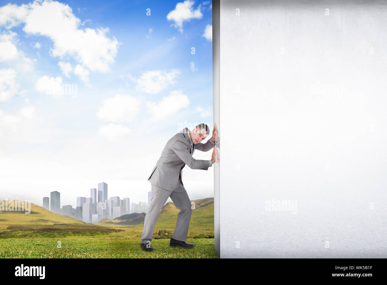 Composite image of businessman pushing away scene of grey room Stock ...