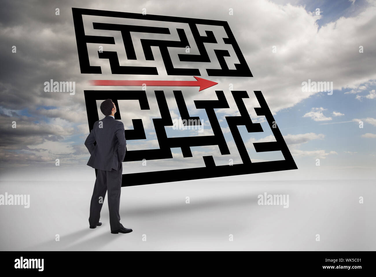 Businessman standing against entrance to difficult maze puzzle Stock ...