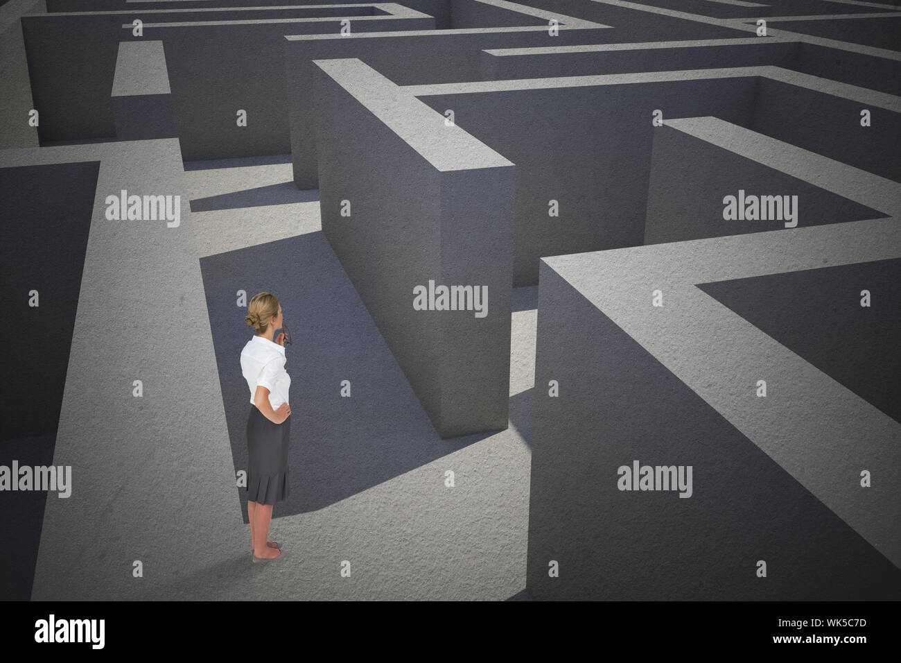 Thinking businesswoman against maze puzzle Stock Photo - Alamy