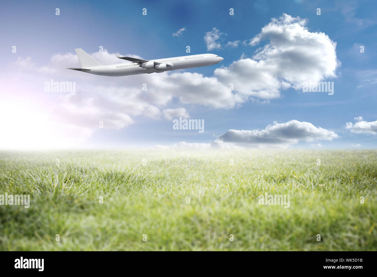 Plane flying over field grass hi-res stock photography and images - Alamy