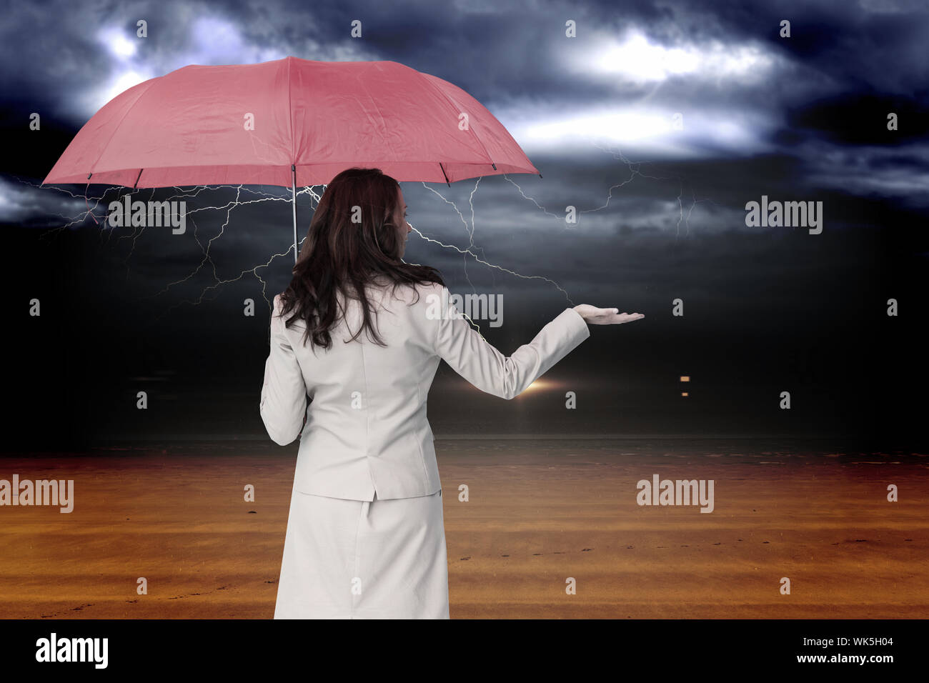 Hand holding umbrella over woman hi-res stock photography and images ...