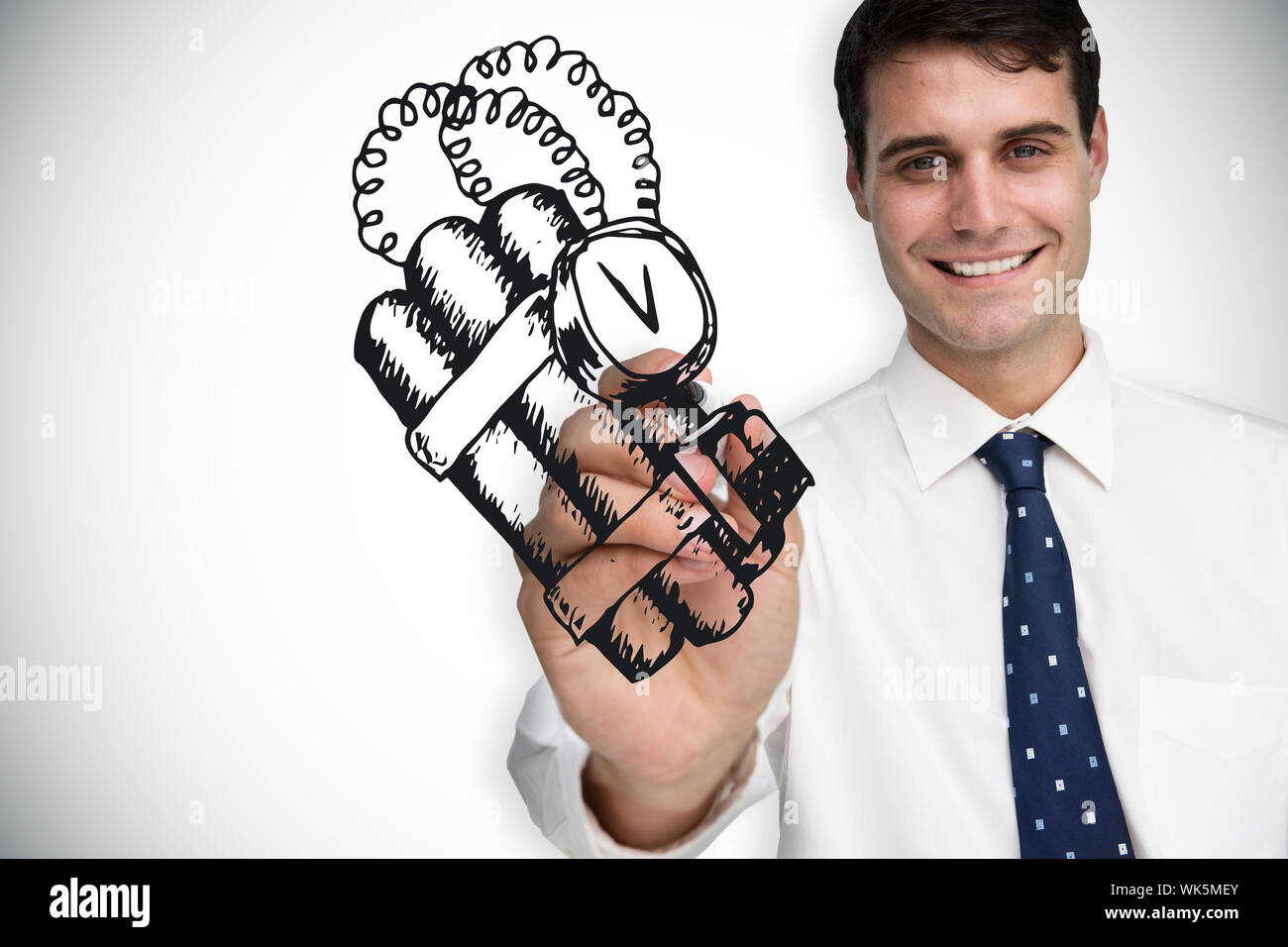 Composite image of businessman drawing dynamite against white ...