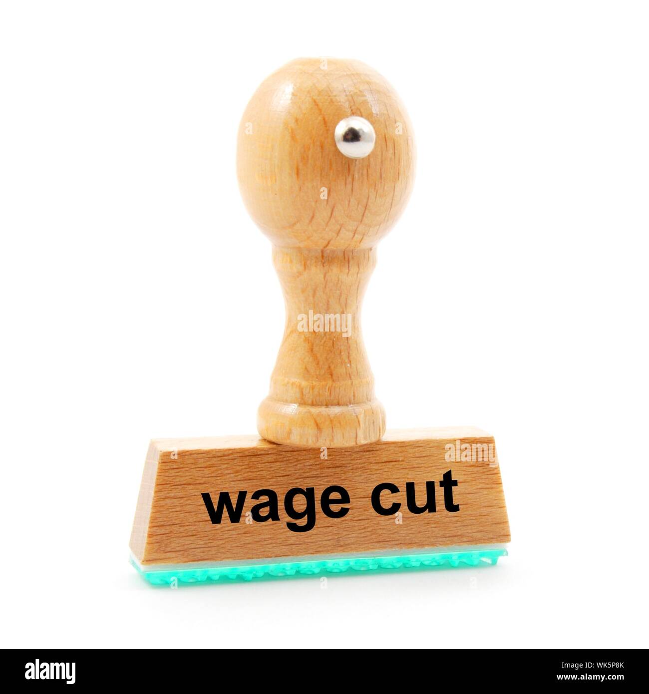 wage cut concept with stamp in office or bureau showing financial ...