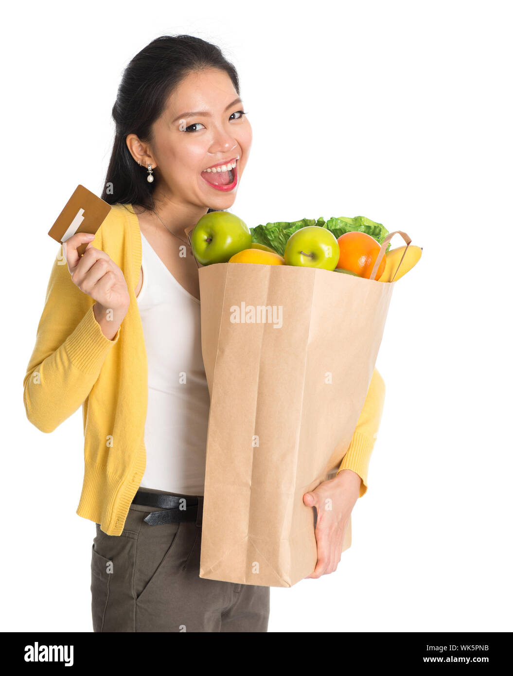 Happy Young Pan Asian Woman Holding Paper Shopping Bag Full Of