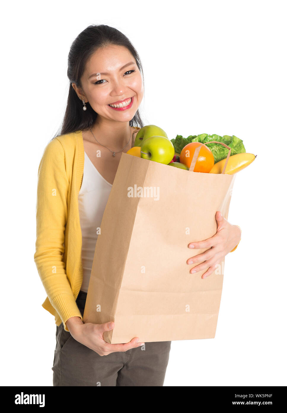 Happy Smiling Young Pan Asian Woman Holding Paper Shopping Bag Full Of