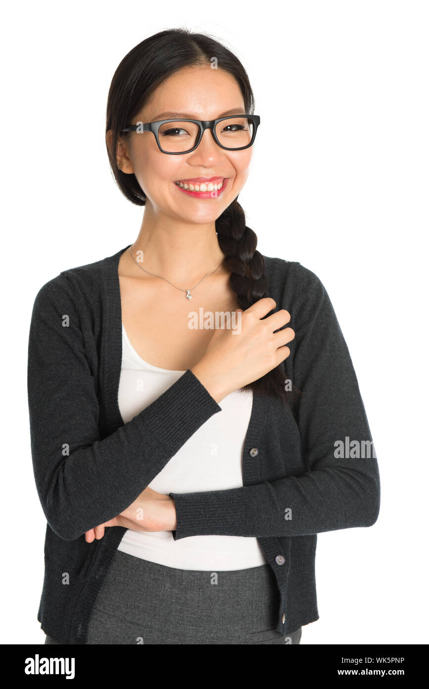 Portrait of Asian young female executive standing isolated on white ...