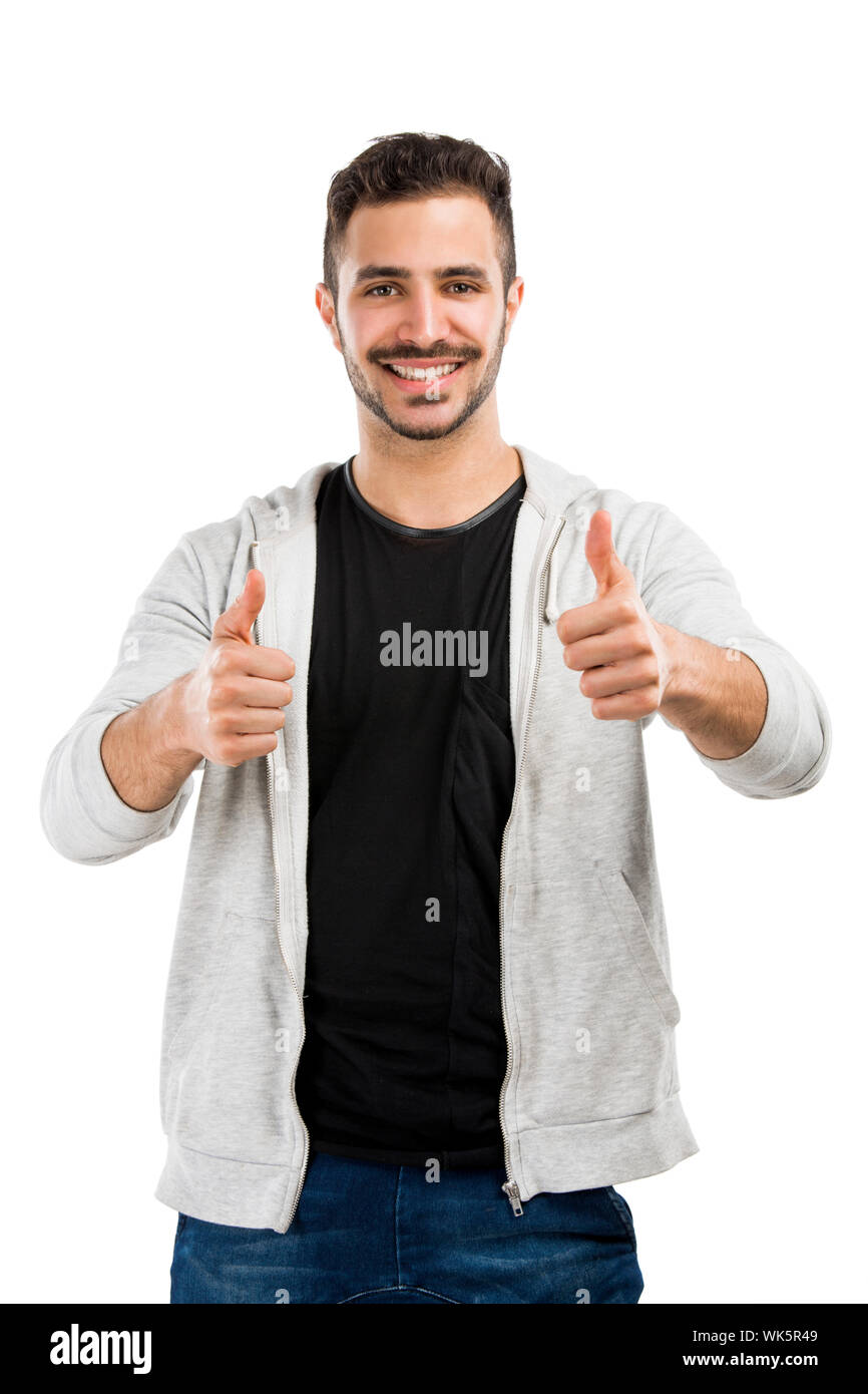 Beautiful and happy man smiling with thumbs up Stock Photo - Alamy