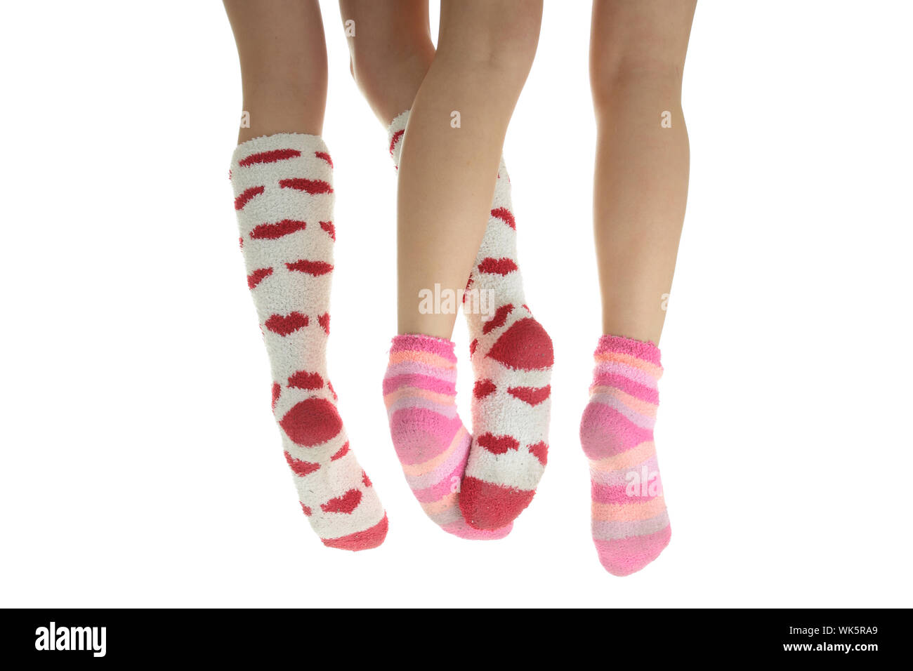 Four crossed legs with colorful socks (isolated on white) - friendship ...