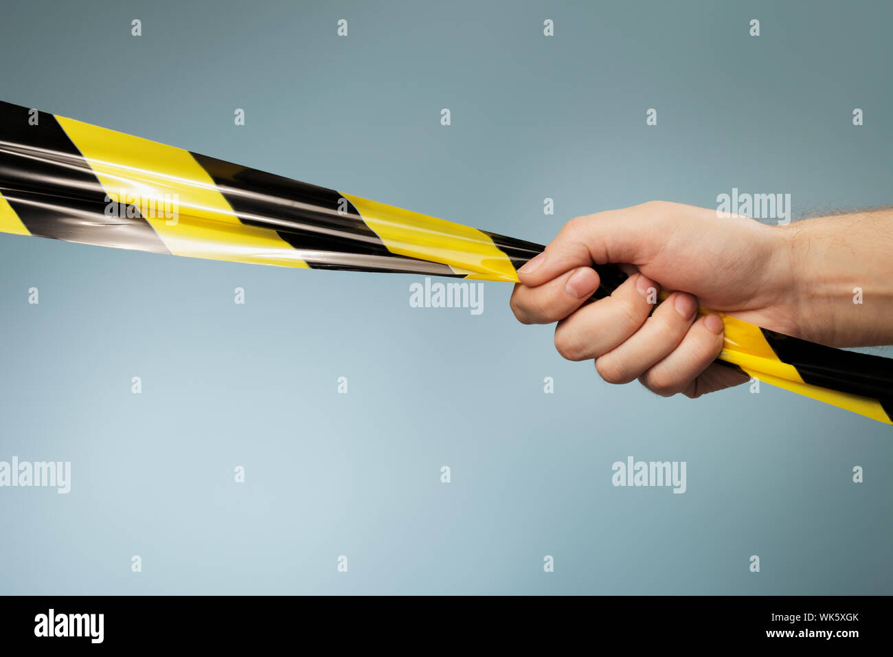 Barrier of yellow tape man holding hi-res stock photography and images ...