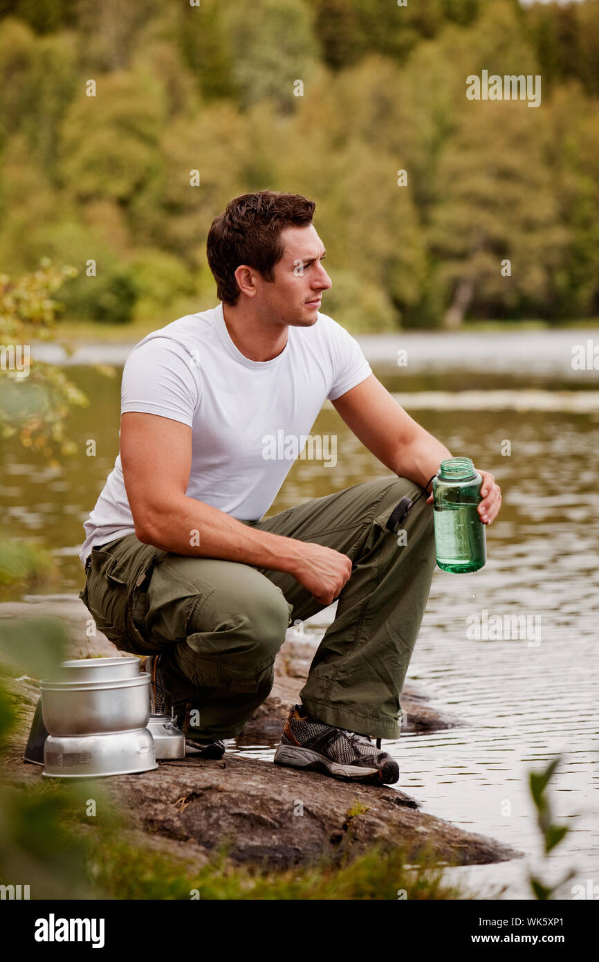 Man Getting Water Stock Photo - Alamy