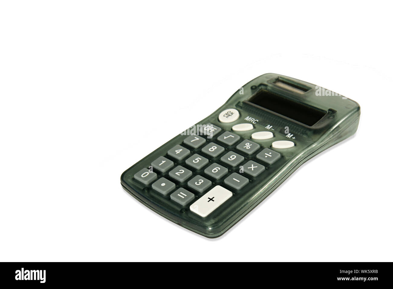 Simple gray calculator placed at an angle, isolated on white. Focus on ...