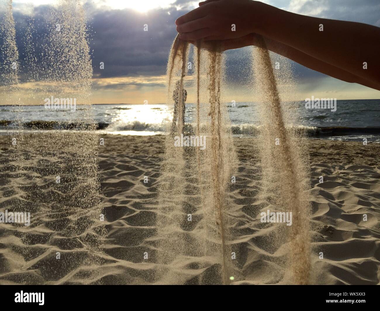 Hand Pouring Sand High Resolution Stock Photography and Images - Alamy