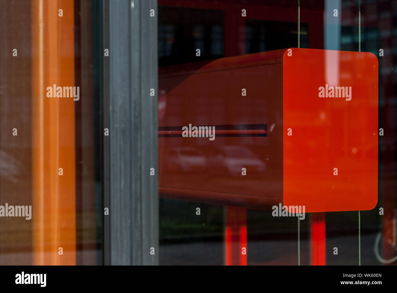 Red Box Seen Through Glass Window Stock Photo - Alamy