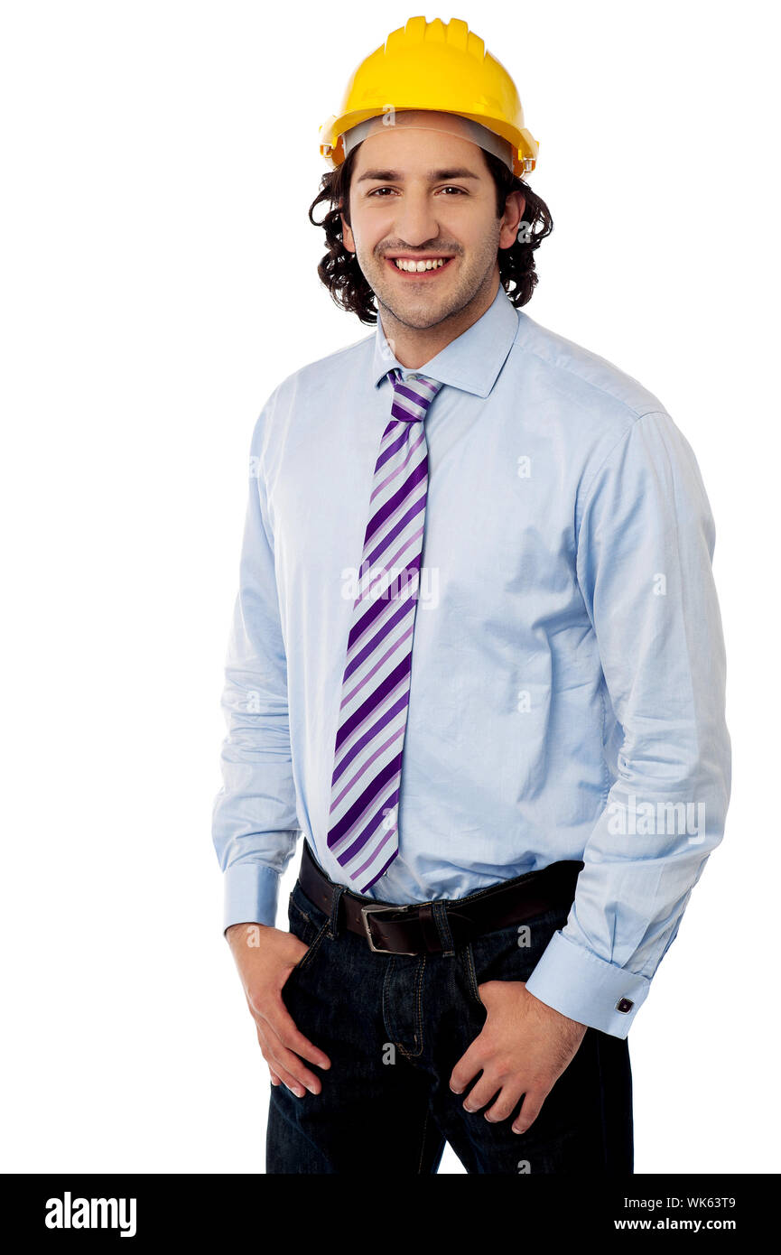 Smiling engineer with his hand in his pockets Stock Photo - Alamy