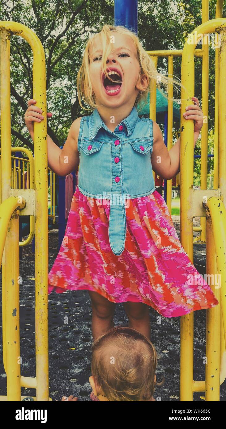 Two girls playing in the park hi-res stock photography and images - Alamy