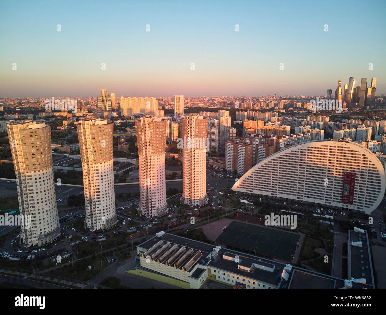 Cityscape with four high-rise residential buildings, city blocks and ...