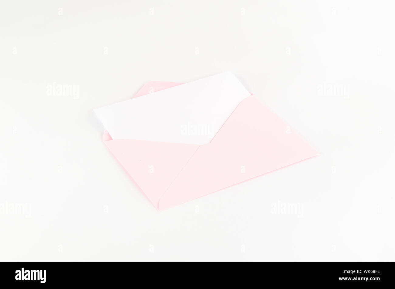 open envelope with white paper on a white background Stock Photo - Alamy