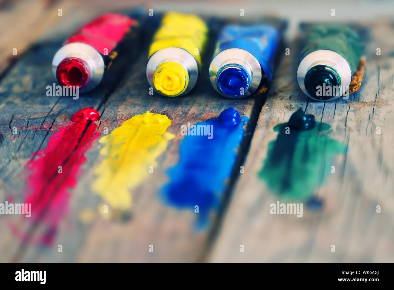 Photo of 4 paint tubes: red, yellow, blue and green Stock Photo - Alamy