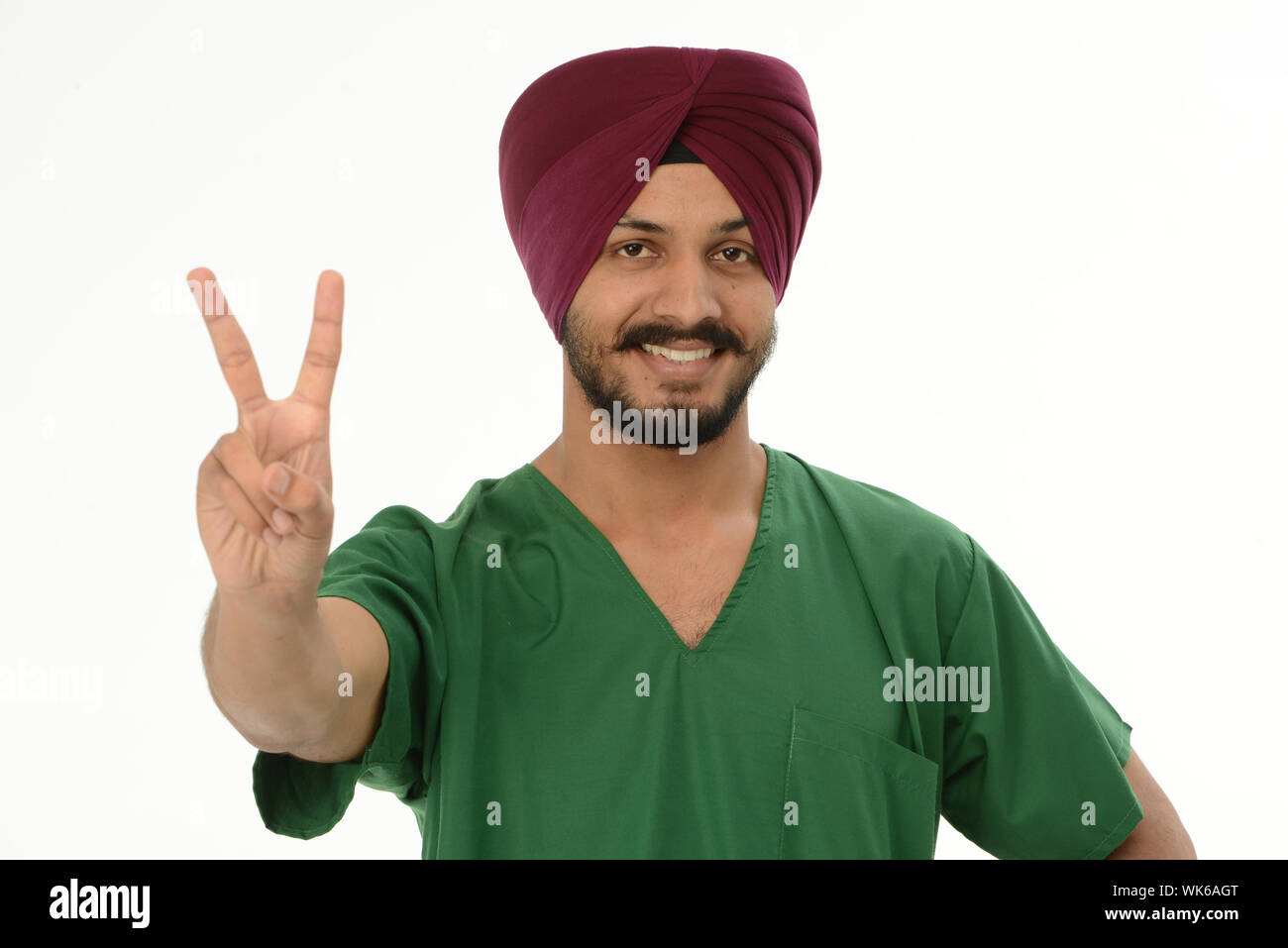 Patient smiling and showing V sign Stock Photo - Alamy