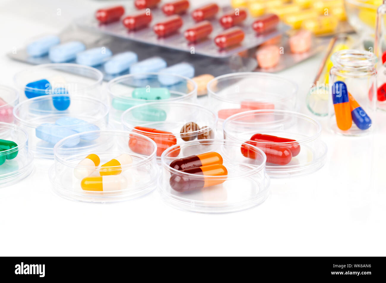 Colorful medical capsules in Petri dishes. Laboratory concept Stock ...