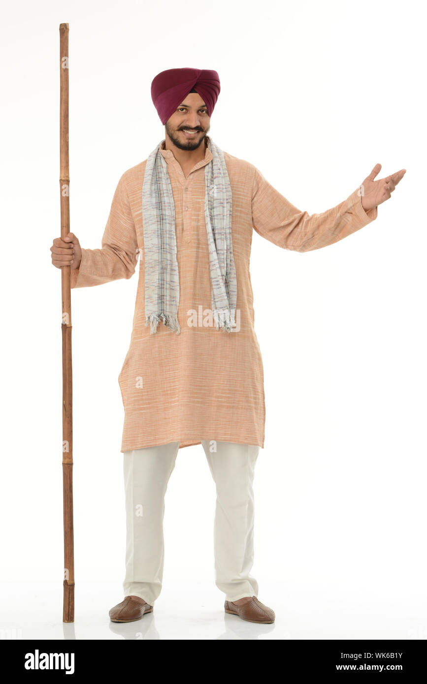 Rural man standing with his cane Stock Photo - Alamy