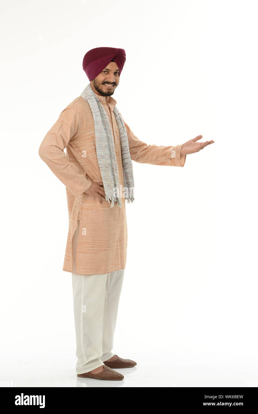 Rural man standing with his arm outstretched Stock Photo - Alamy