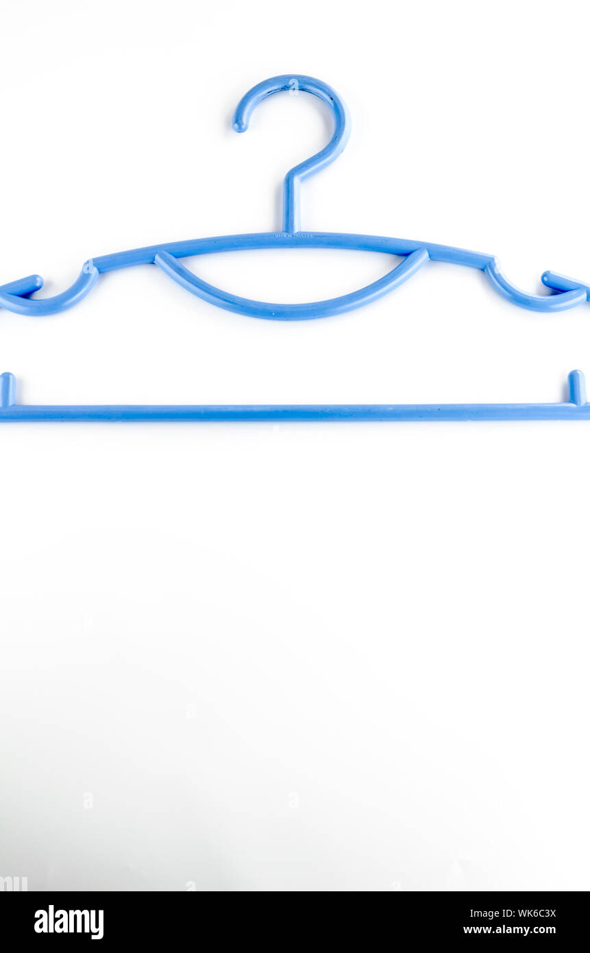 blue plastic clothes hanger on a white background Stock Photo - Alamy