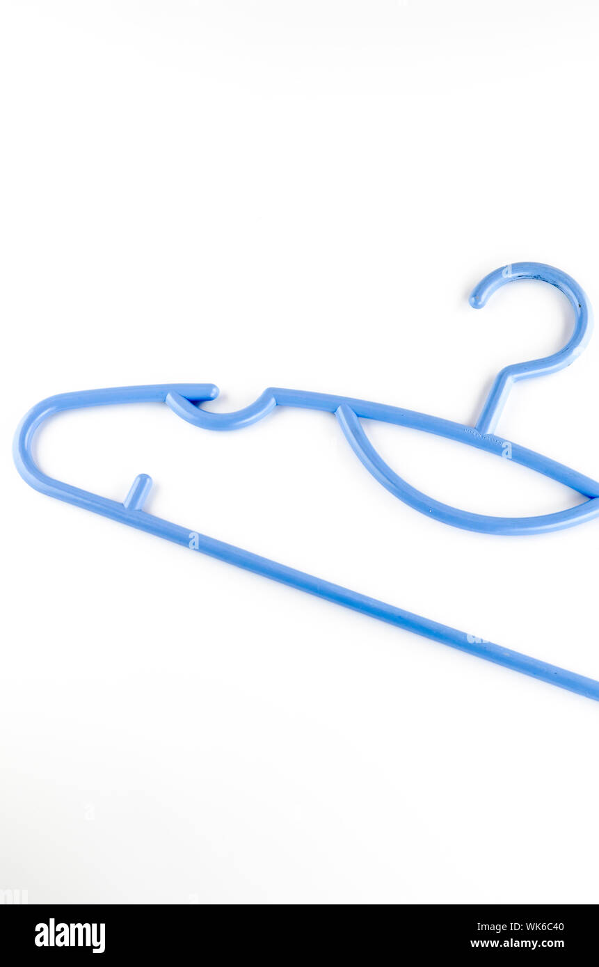 blue plastic clothes hanger on a white background Stock Photo - Alamy