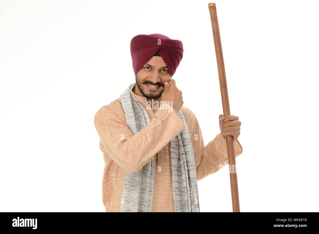 Rural man standing with his cane Stock Photo - Alamy
