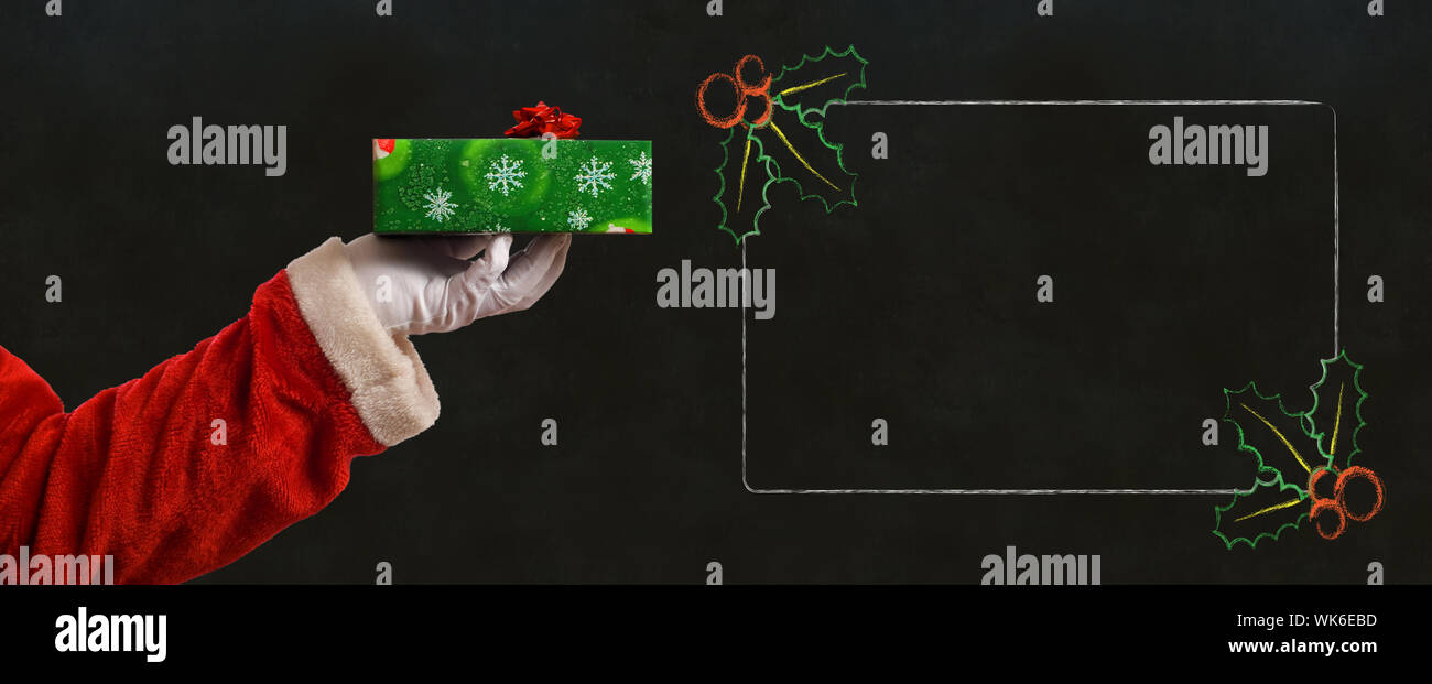 Santa Claus Father Christmas hand with wrapping paper present and list ...