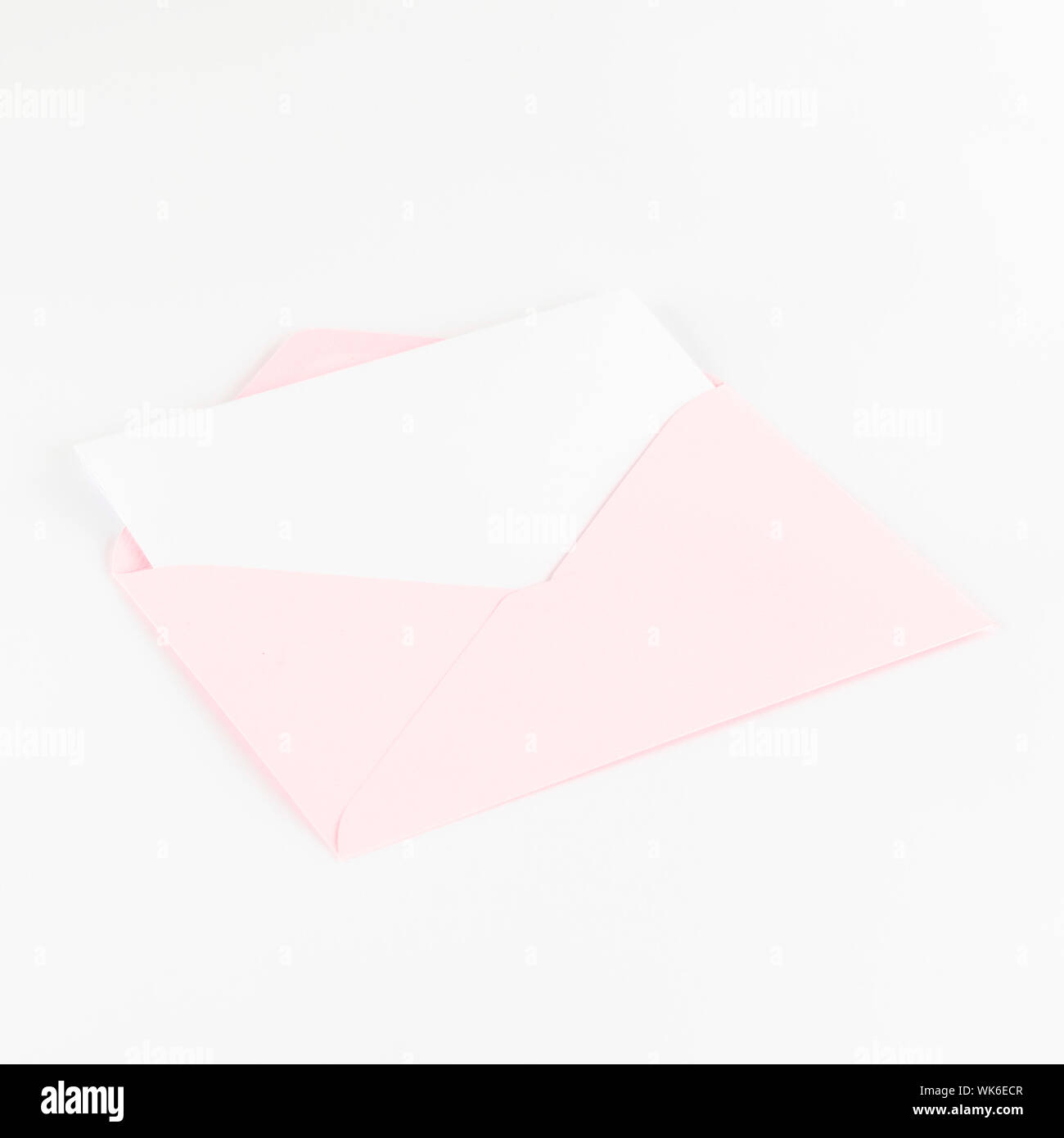 open envelope with white paper on a white background Stock Photo - Alamy