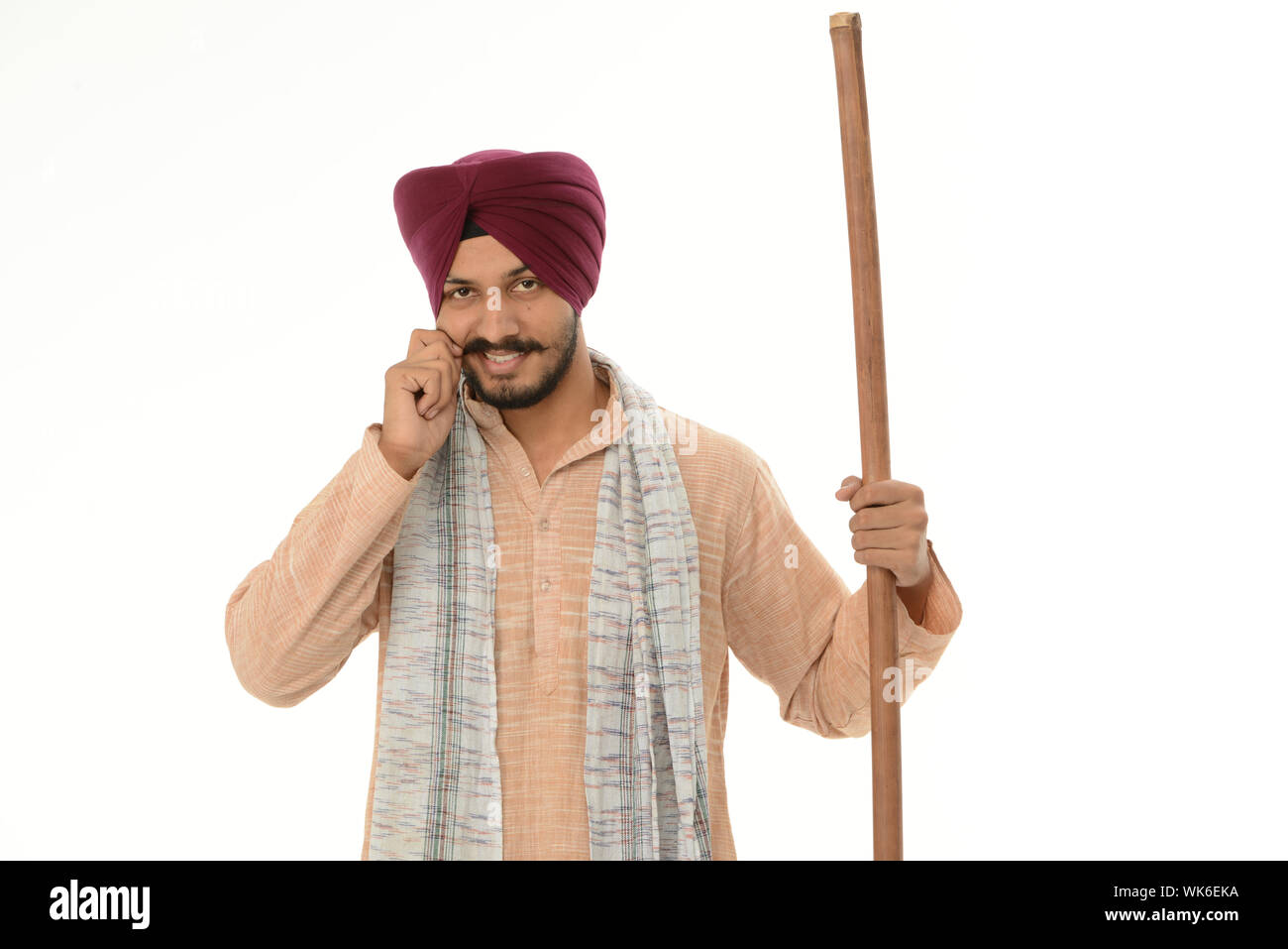 Rural man standing with his cane Stock Photo - Alamy