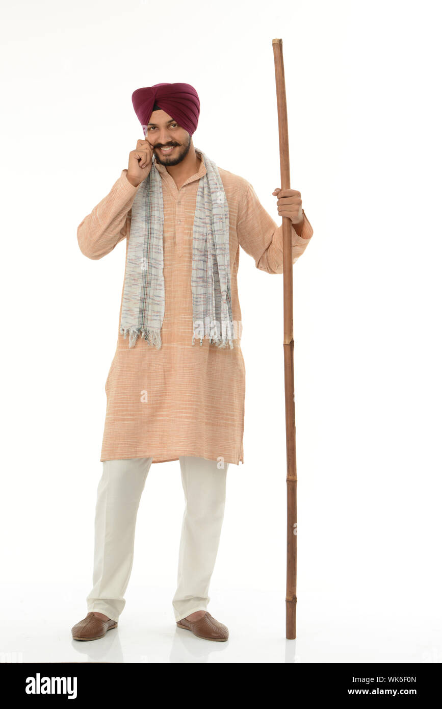 Rural man standing with his cane Stock Photo - Alamy