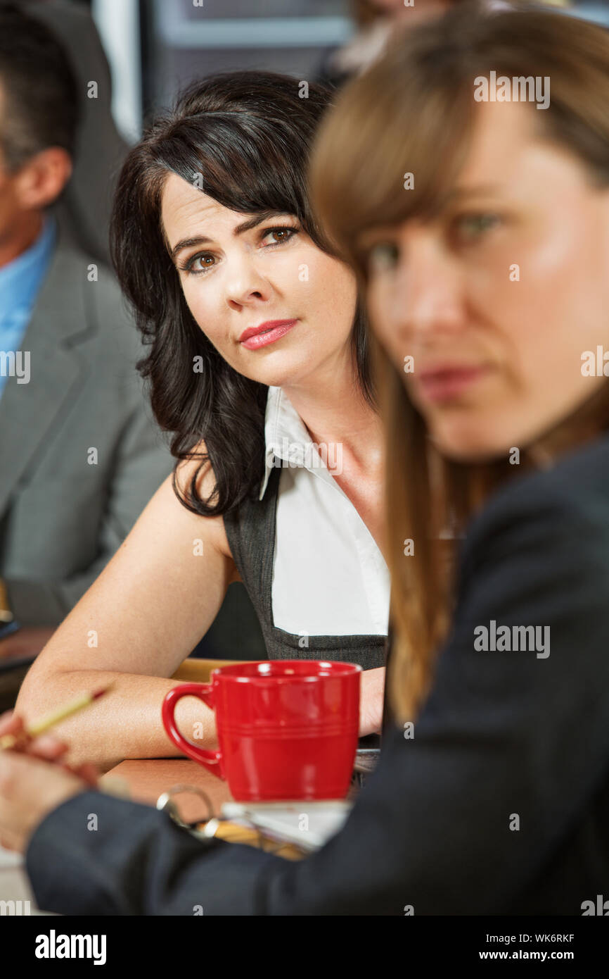 Pair of serious female executives in restaurant Stock Photo - Alamy