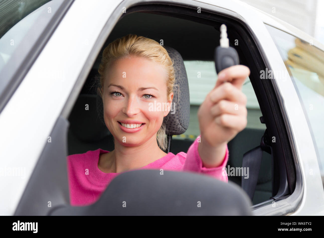 Woman driver showing car keys Stock Photo - Alamy