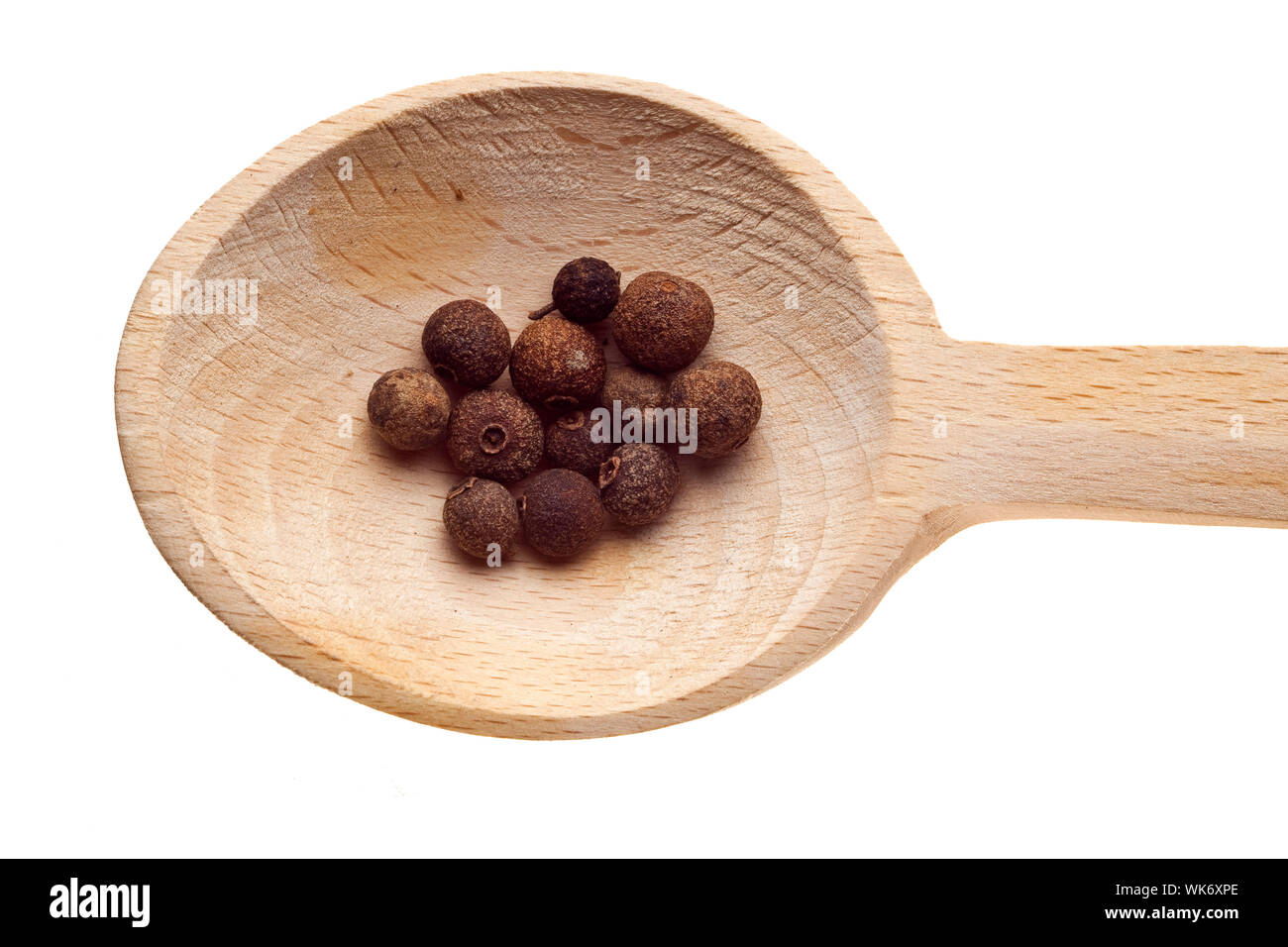 Herbs and spices on wooden spoons - pepper Stock Photo - Alamy